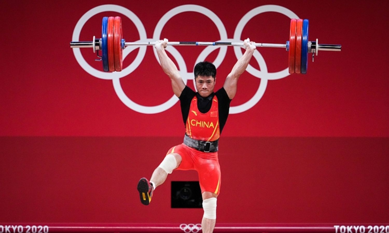 Chinese weightlifter Li Fabin wins Olympic gold after a unique one ...